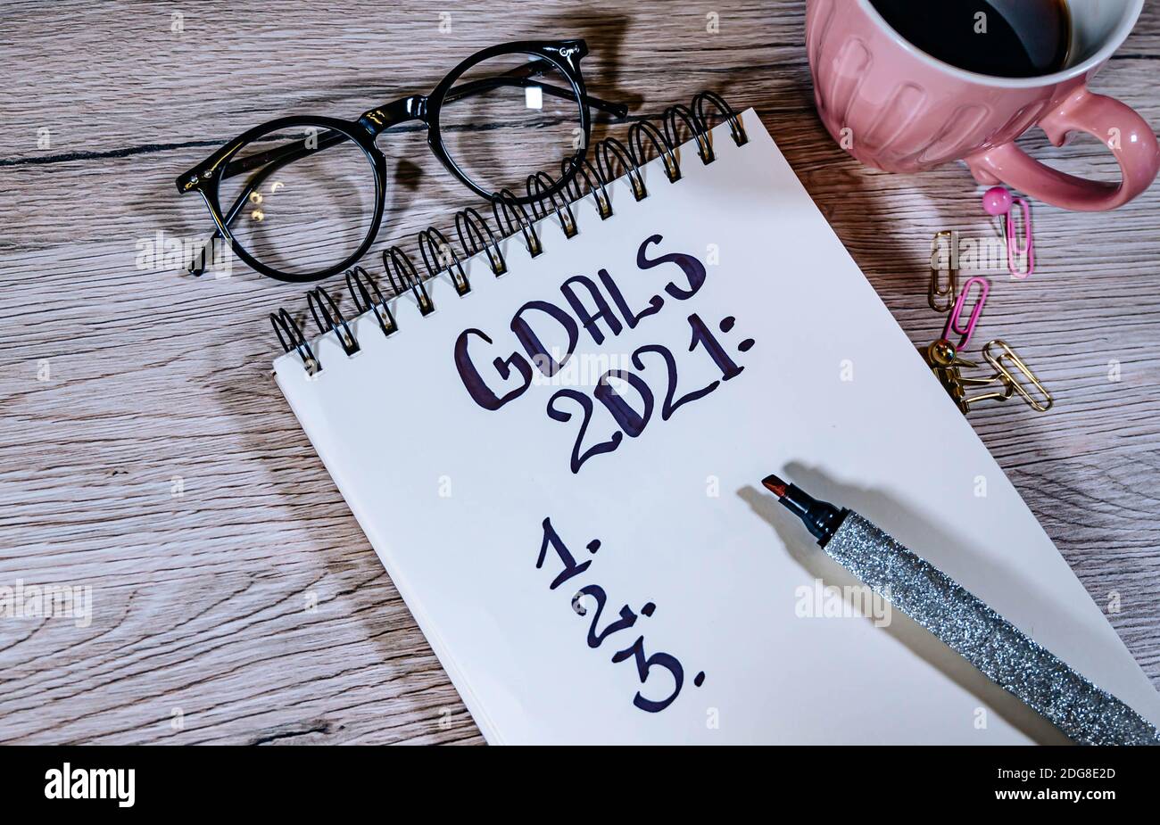 Goals 2021 concept. 2021 plan notepad list concept, hand writting ...