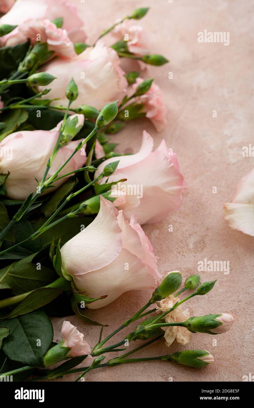 Flowers composition made of coral carnation and pink roses Stock Photo ...