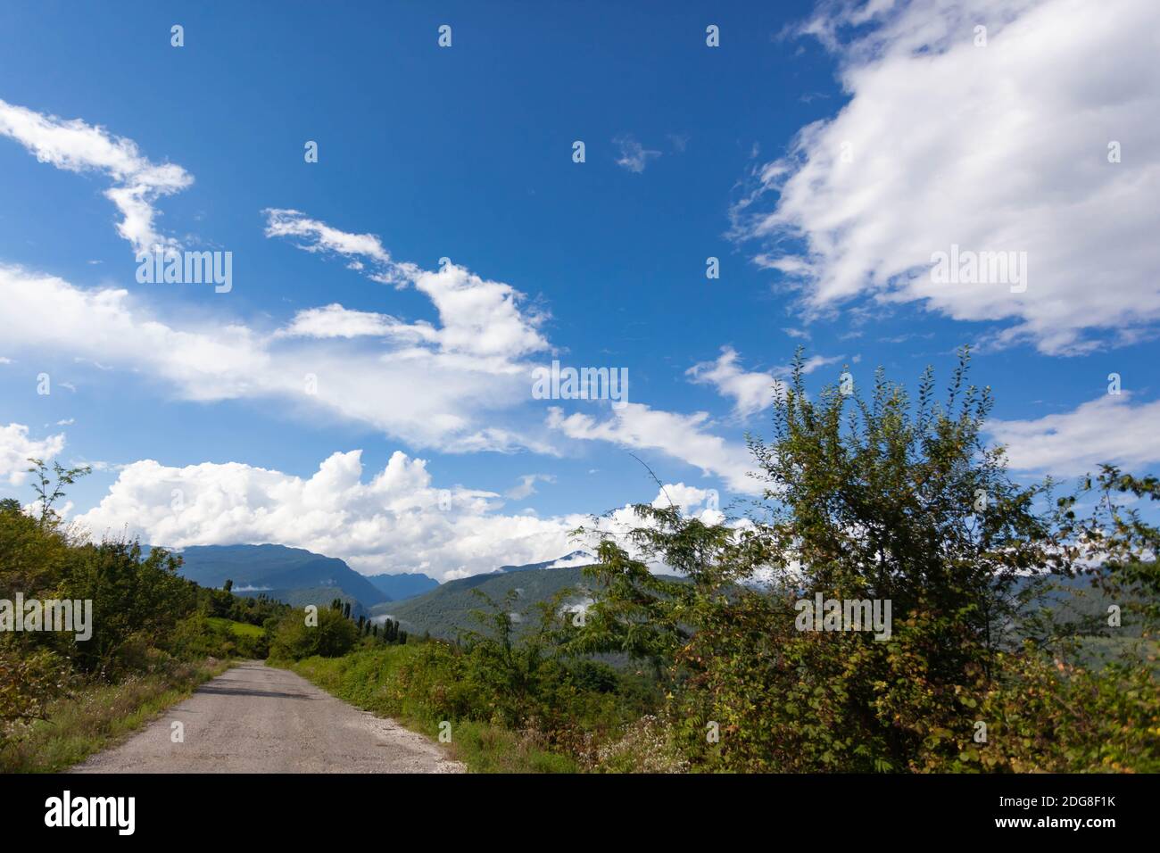 Old mountain road against the backdrop of mountains Stock Photo - Alamy