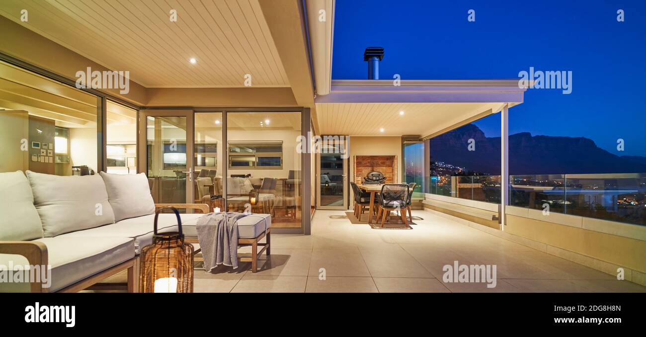 Luxury home showcase exterior patio at night Stock Photo - Alamy