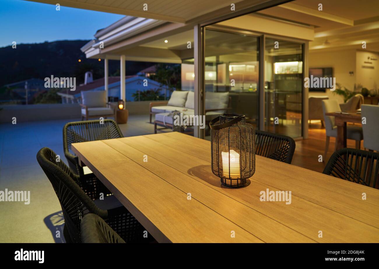 Lantern with candle on luxury home showcase patio dining table Stock ...