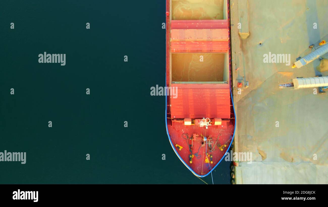 Cargo ship in port with open holds loading wheat for exports Stock ...