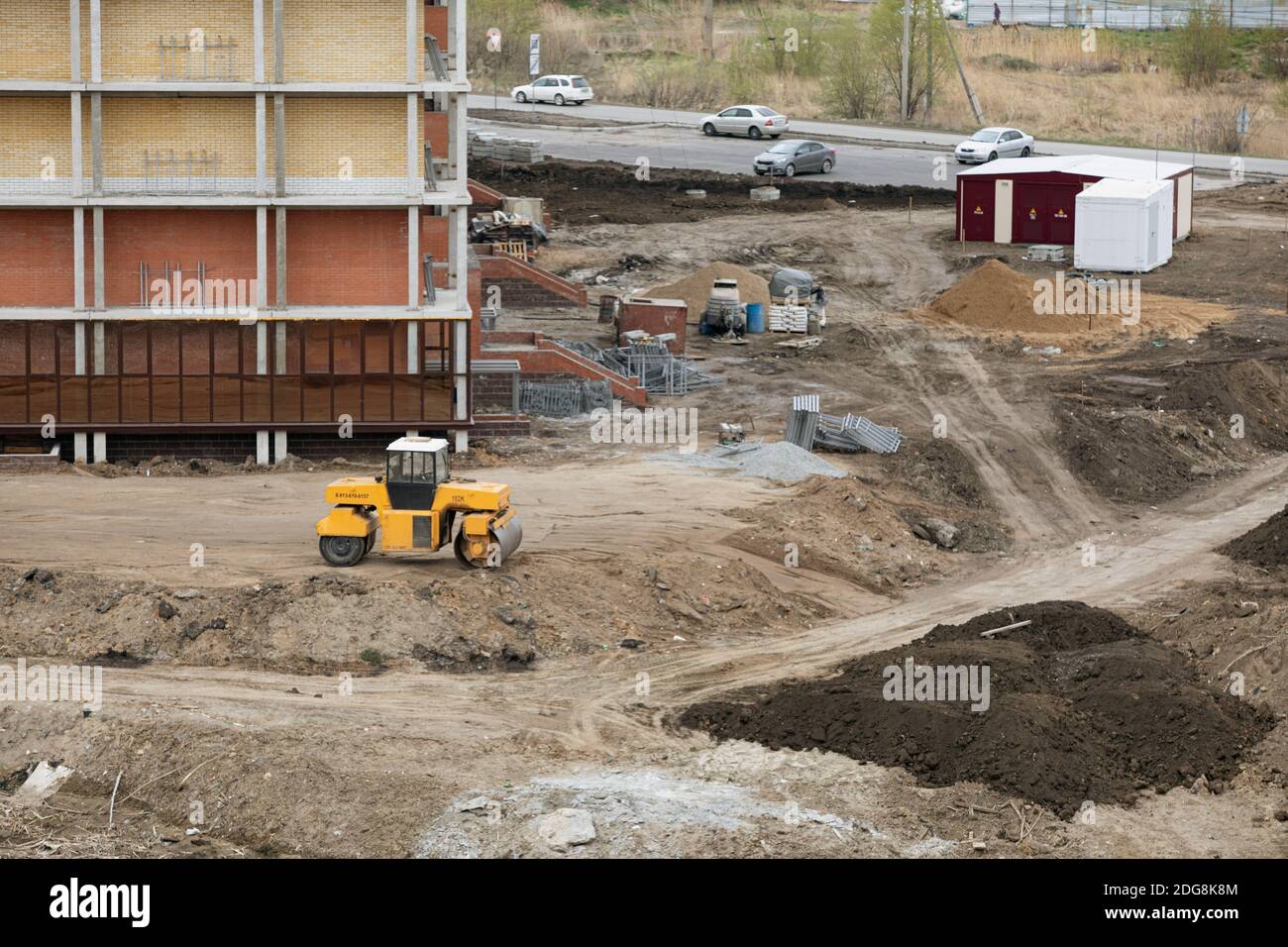 Buldozer making and constructing new asphalt road and clearing ...