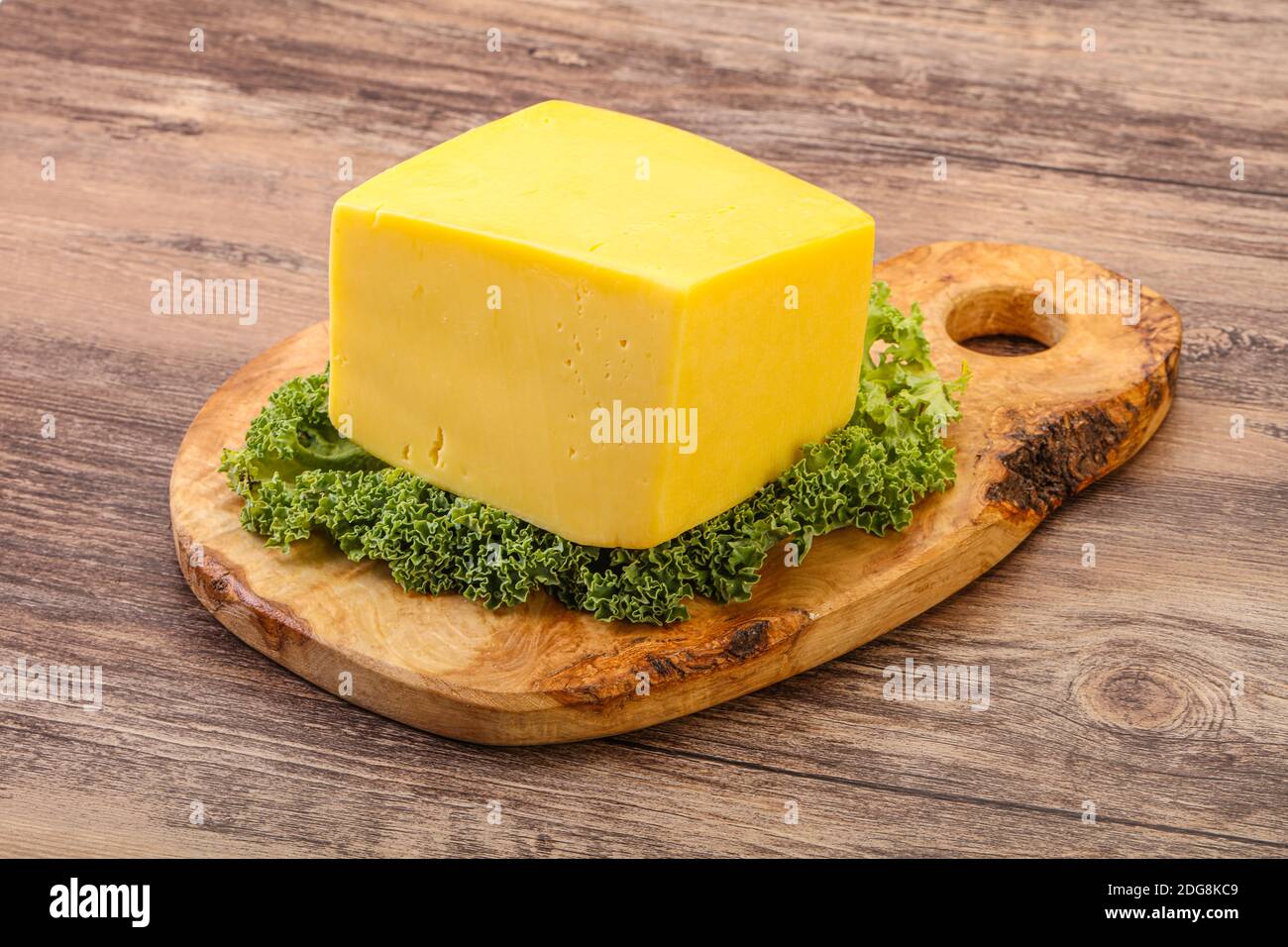 Yellow tilsiter cheese dairy product brick Stock Photo - Alamy