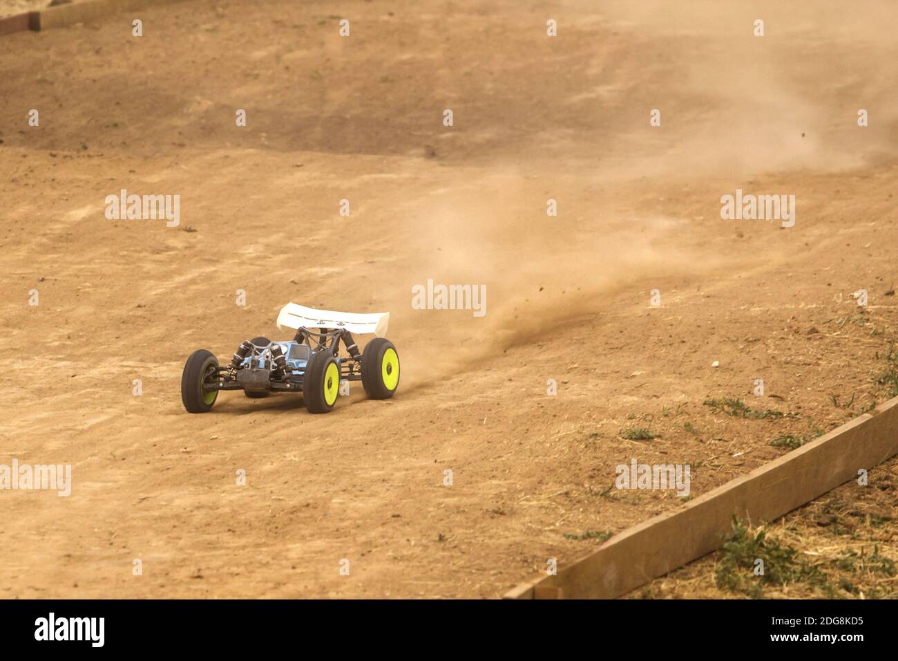 Radio controlled car model in race on dirt track Stock Photo - Alamy