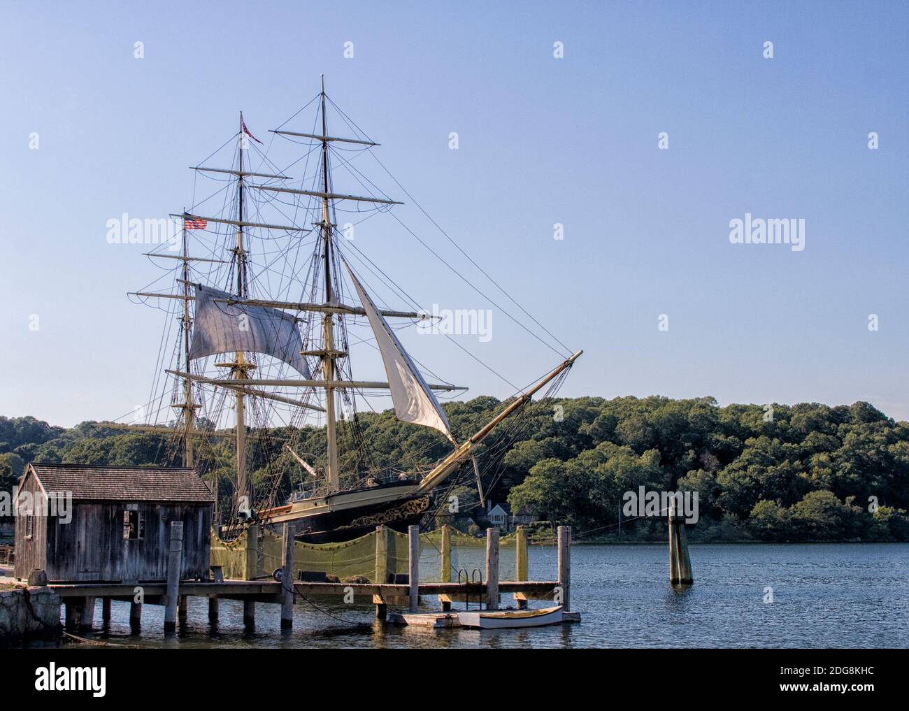 Beautiful old sailing boat with three masts in natural harbor Stock ...