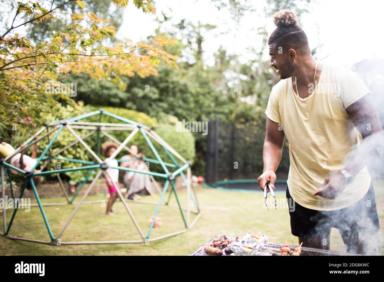 Man watching kids play hi-res stock photography and images - Alamy