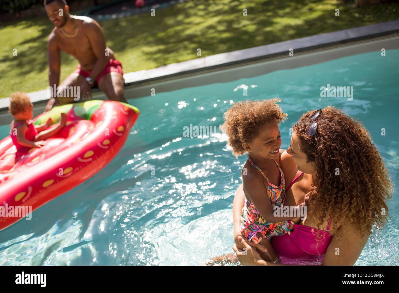 Mother daughter in swimsuit playing High Resolution Stock Photography ...