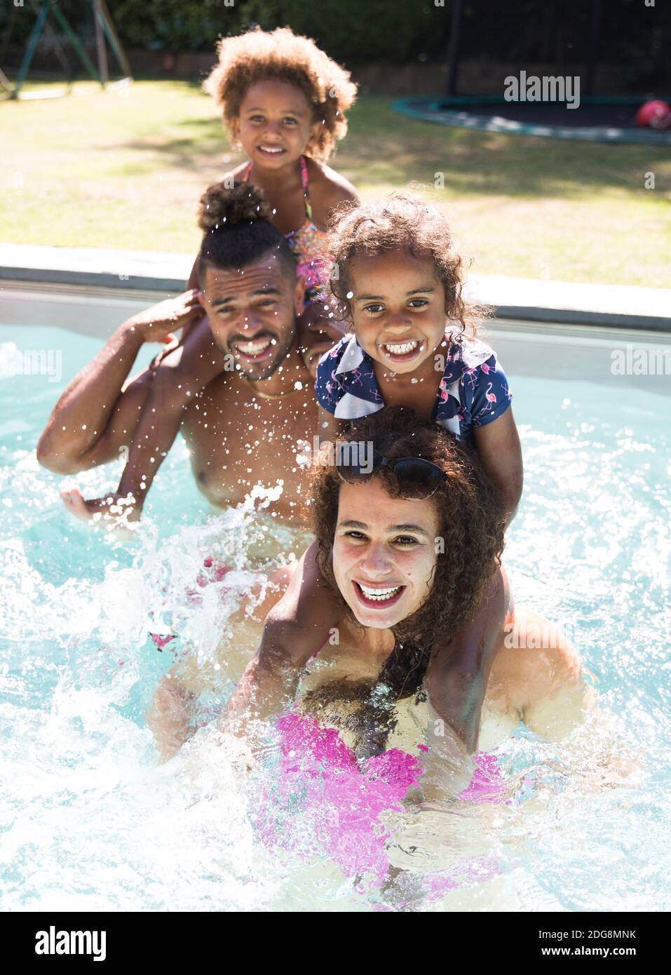 Family portrait in pool hi-res stock photography and images - Alamy