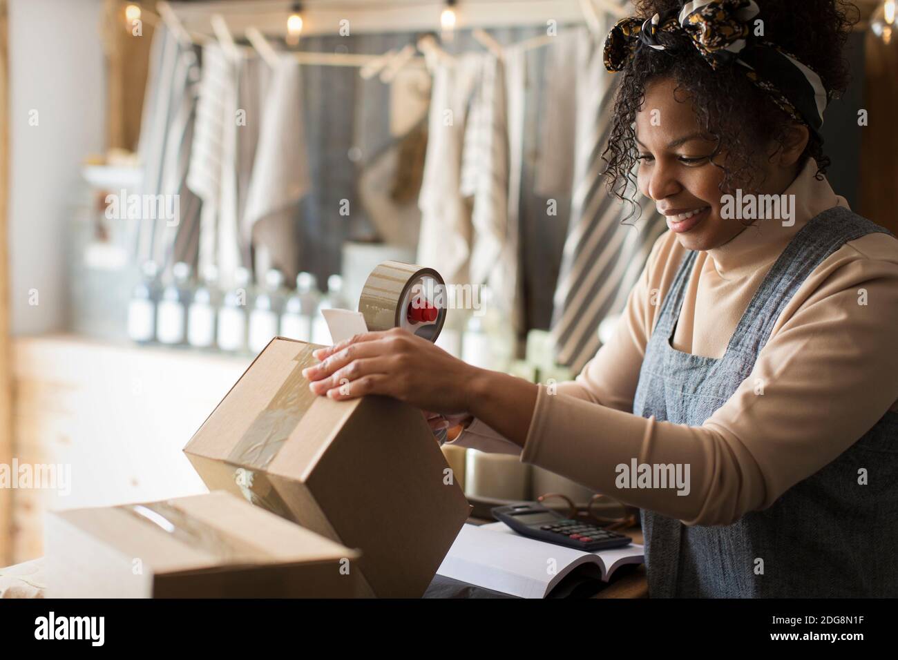 Female shop owner preparing box for shipment Stock Photo - Alamy Female shop owner preparing box for shipment Stock Photo - Alamy