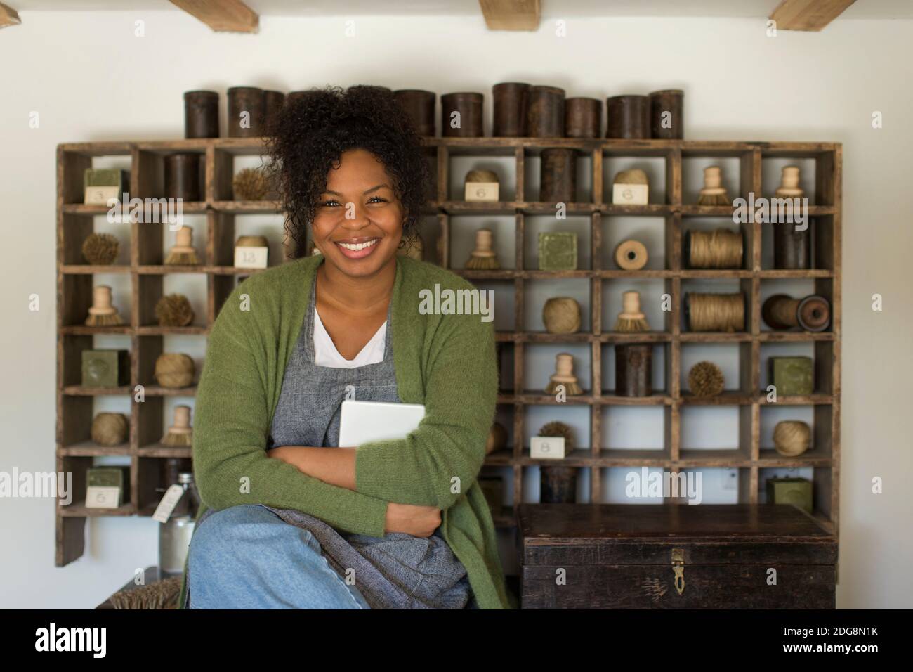 Portrait happy confident female shop owner at vintage display Stock ...