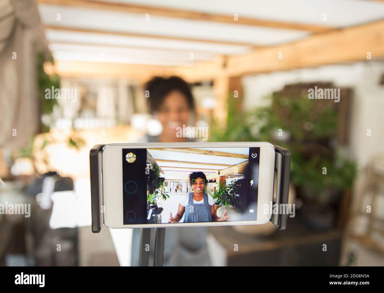 Woman filming with phone hi-res stock photography and images - Alamy