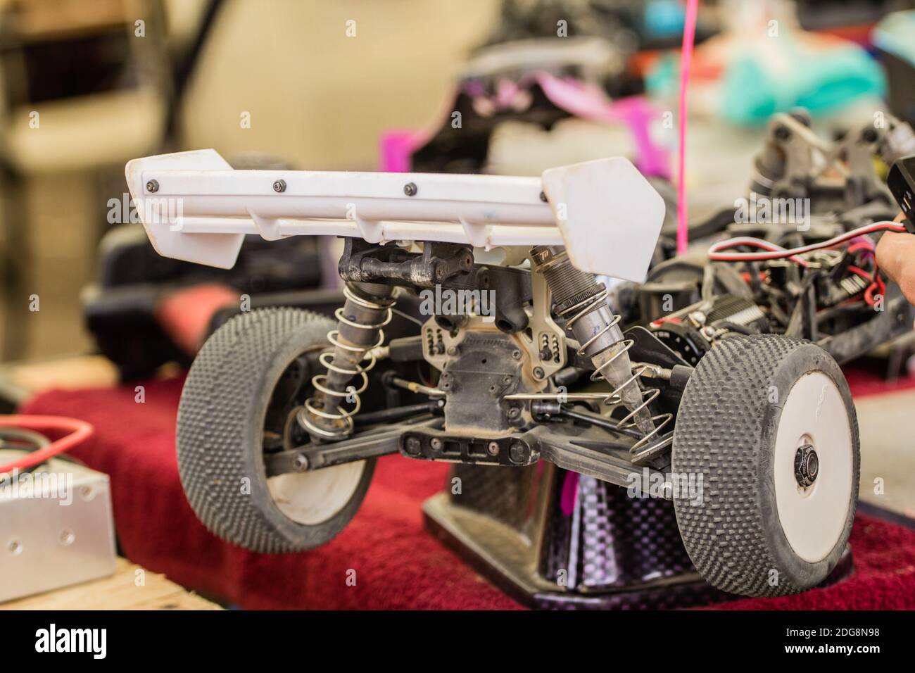 Maintenance of radio-controlled model of the car in a break between ...