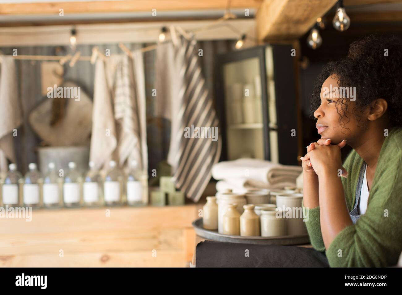 Young woman behind shop counter hi-res stock photography and images - Alamy