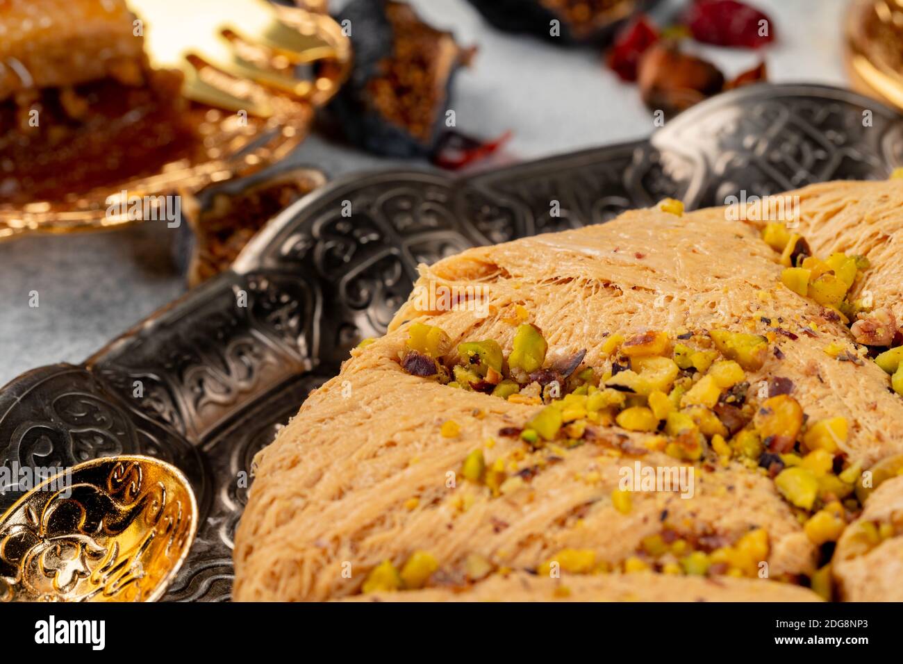 Turkish pastries and scattered dry fruits on table Stock Photo - Alamy