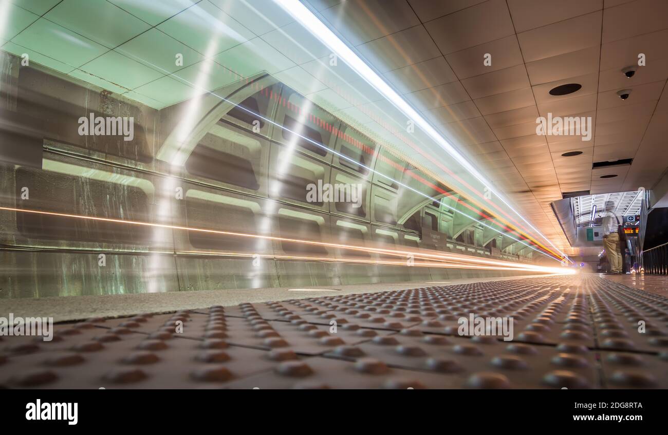 Fast moving long exposure of subway train underground tunnel Stock ...