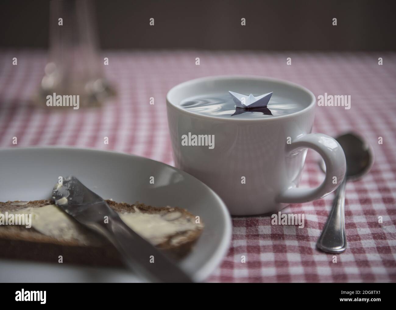 Small Paper Boat in a Cup Stock Photo - Alamy