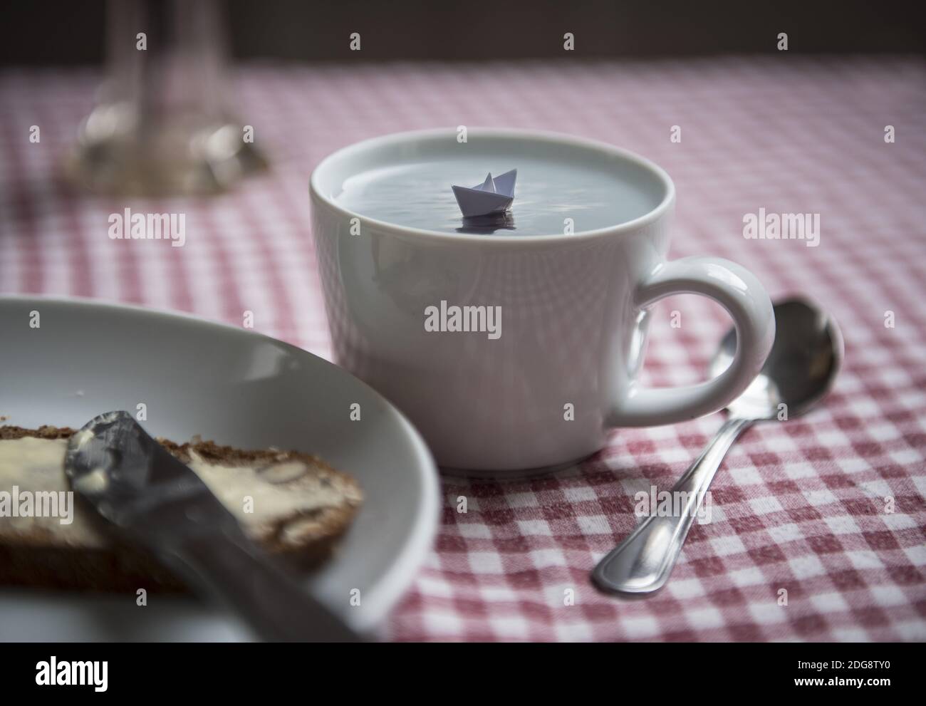 Small Paper Boat in a Cup Stock Photo - Alamy