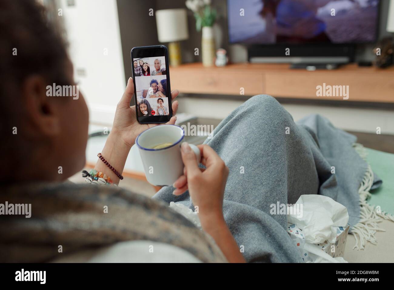 Woman video chatting with family on smart phone screen Stock Photo - Alamy
