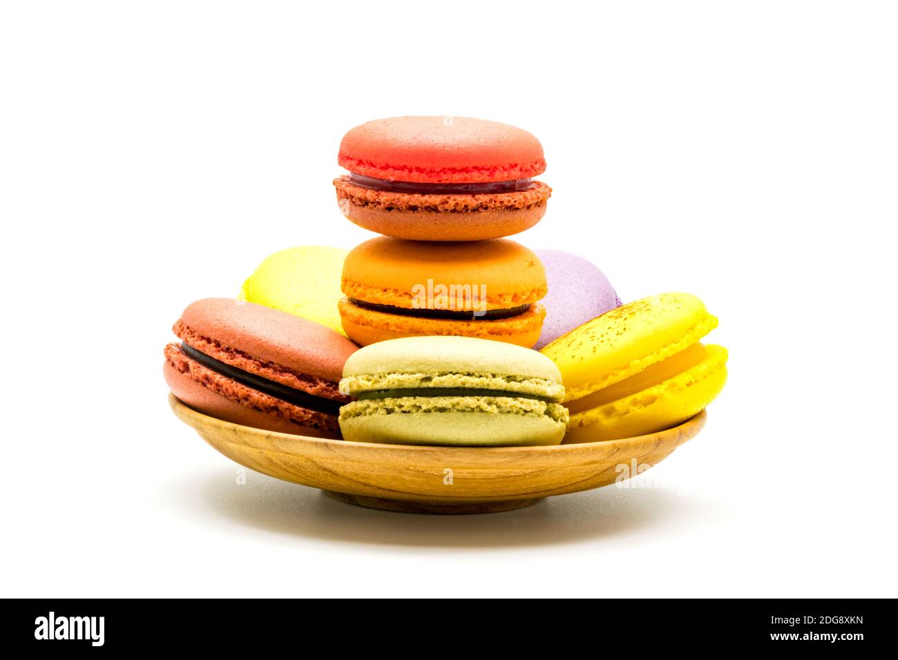 Colorful sweet macarons in wooden plate Stock Photo - Alamy