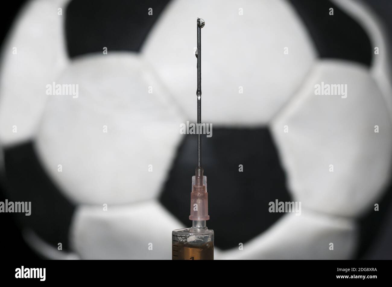 Soccer ball gets an injection with a syringe, doping in sports Stock ...