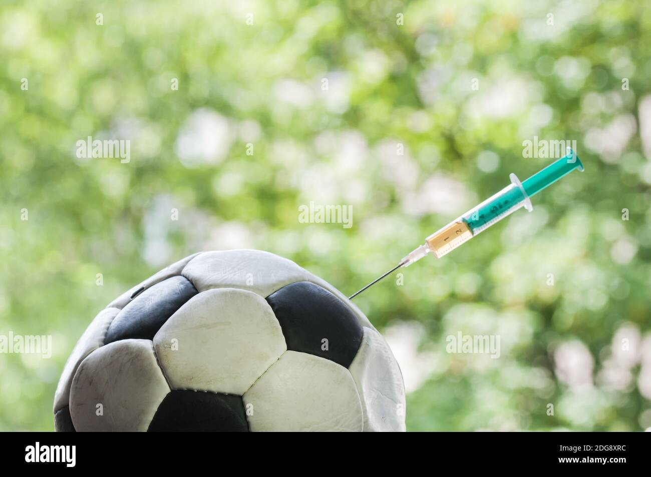 Soccer ball gets an injection with a syringe, doping in sports Stock ...