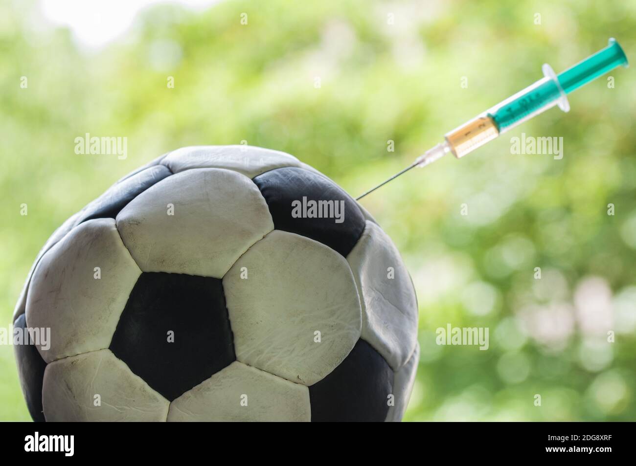 Soccer ball gets an injection with a syringe, doping in sports Stock ...