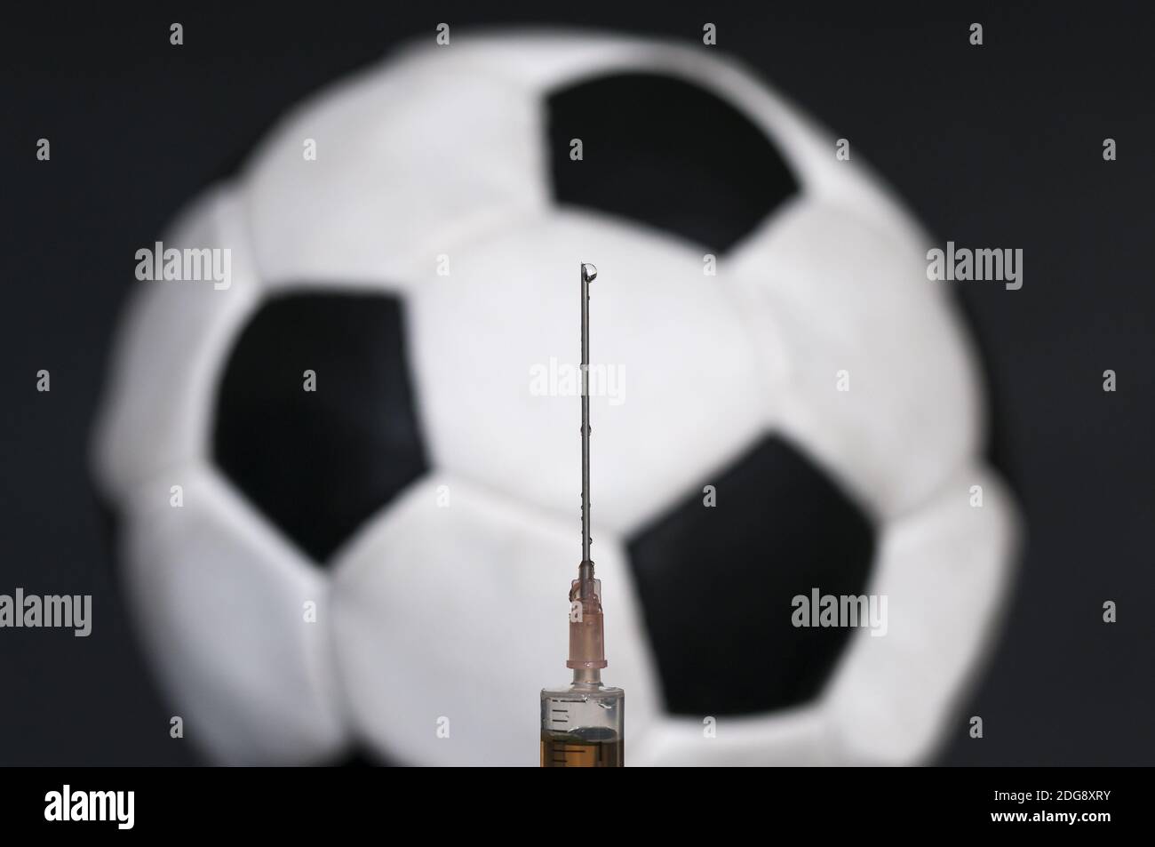 Soccer ball gets an injection with a syringe, doping in sports Stock ...