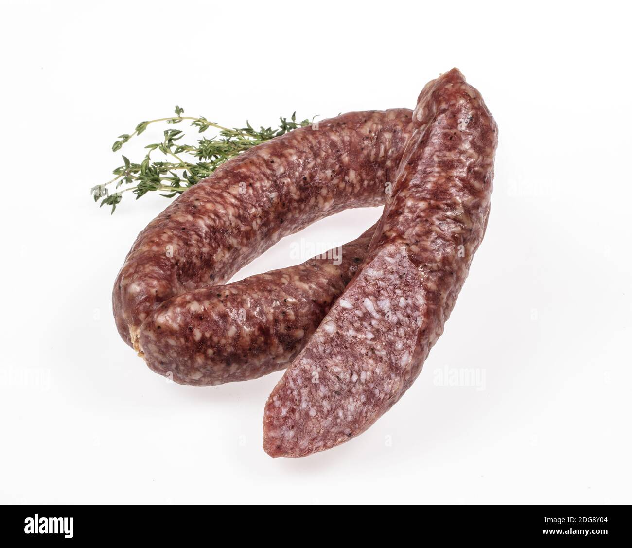 Sausage with greenery on an isolated studio background Stock Photo - Alamy