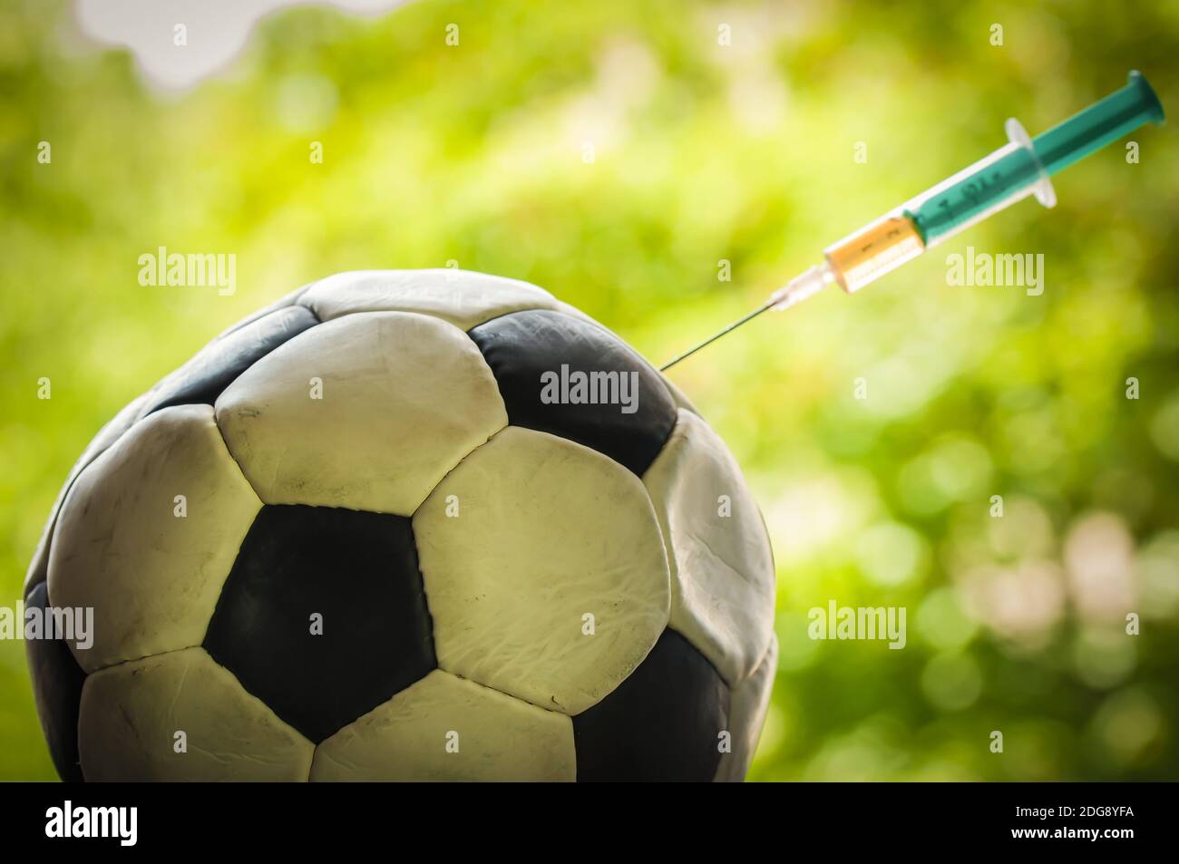 Soccer ball gets an injection with a syringe, doping in sports Stock ...