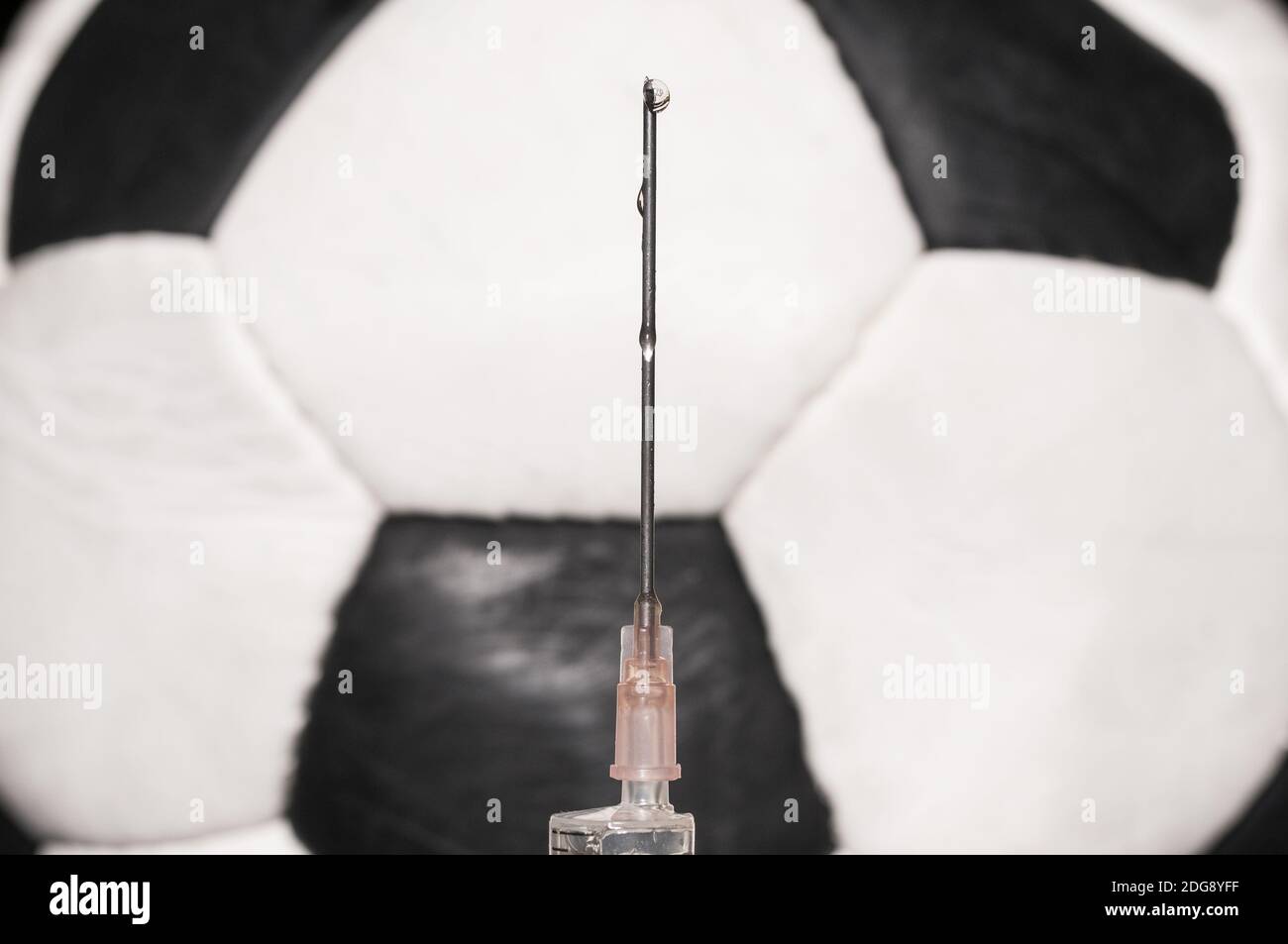 Soccer ball gets an injection with a syringe, doping in sports Stock ...