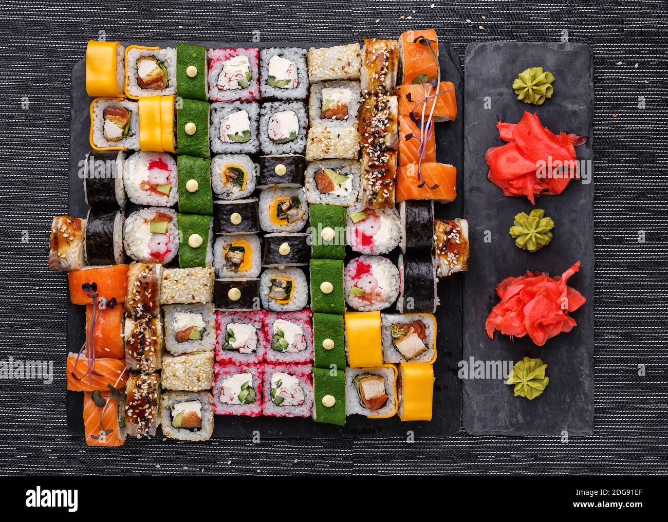 Japanese cuisine. Sushi with fresh ingredients on a black background ...