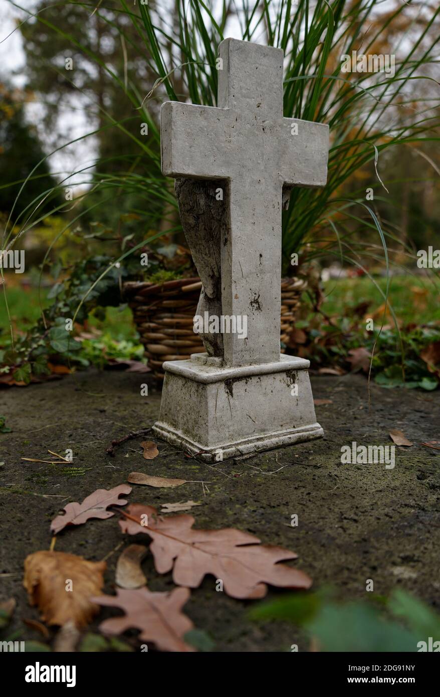 a vertical shot of a white cross on a cemetery during autumn Stock ...