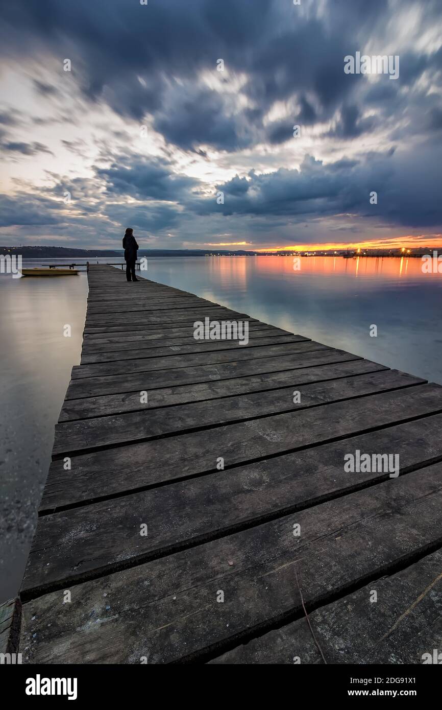 Watching sunset alone hi-res stock photography and images - Alamy