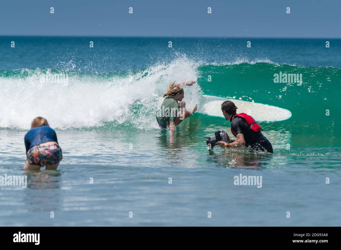 Female surfer falling off board hi-res stock photography and images - Alamy