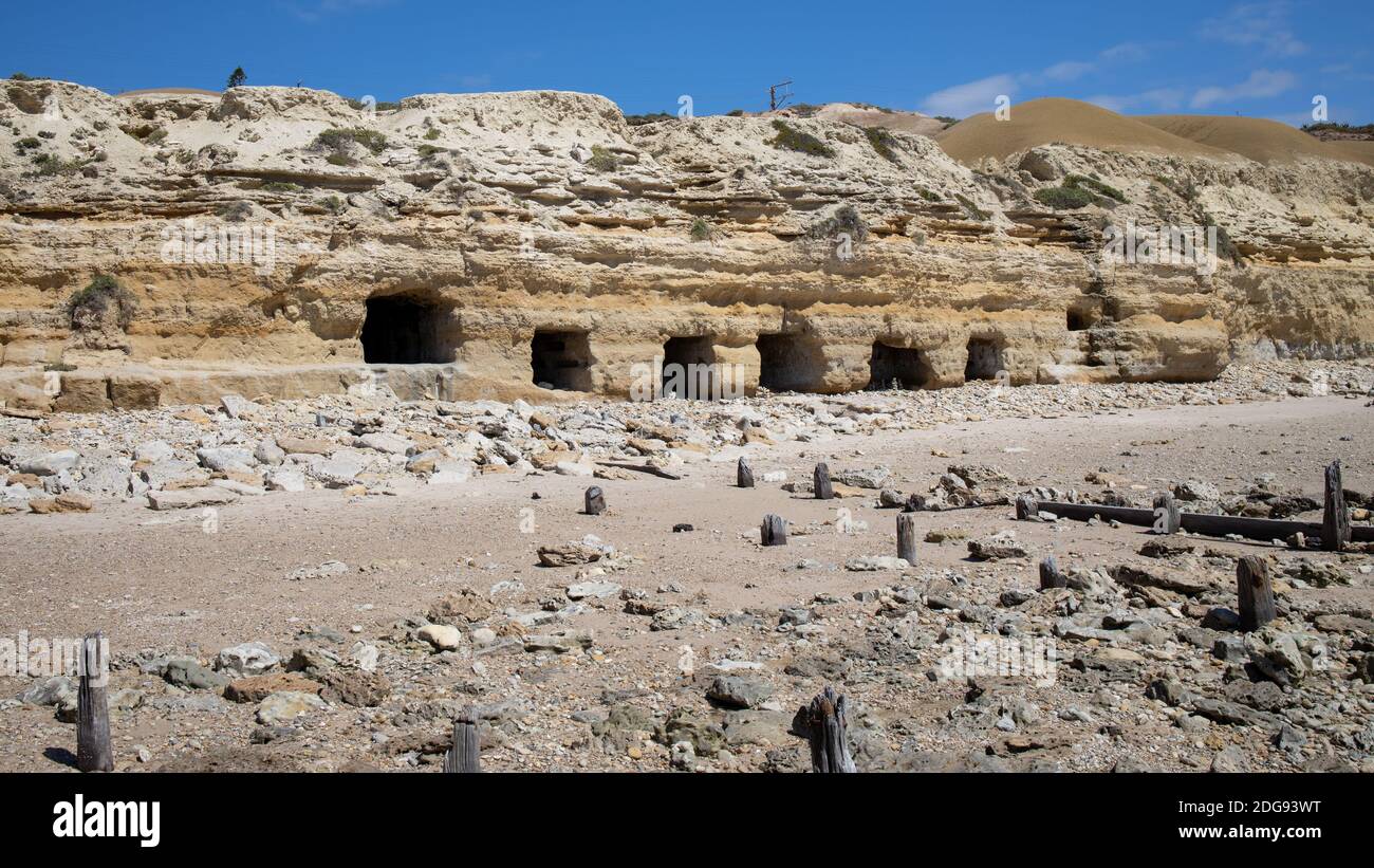 The iconic caves once used for boats on the beach at Port Willunga ...