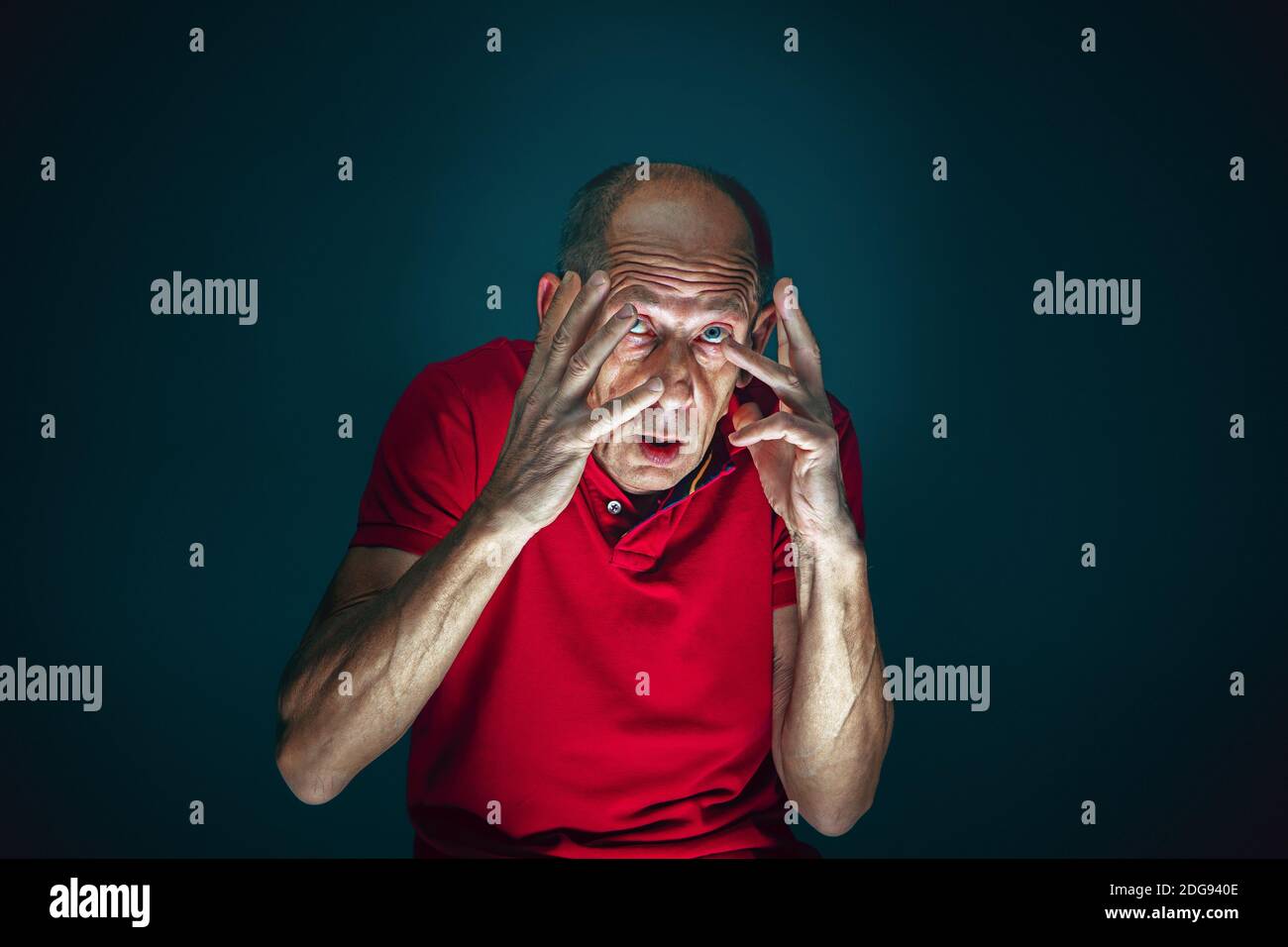 Hiding. Portrait of crazy scared and shocked caucasian man isolated on ...