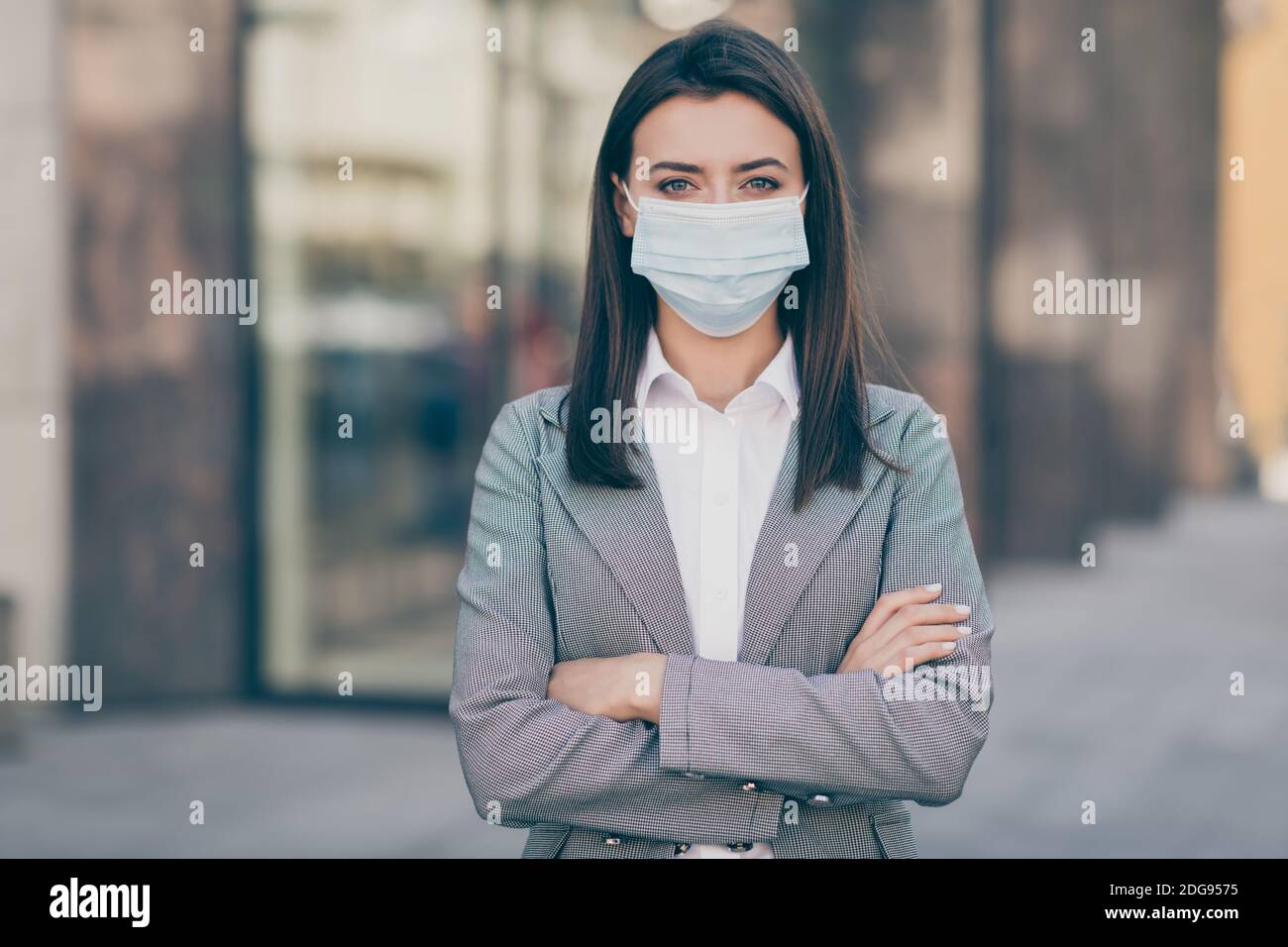 Photo of serious beautiful business lady crossed hands wear respiratory ...