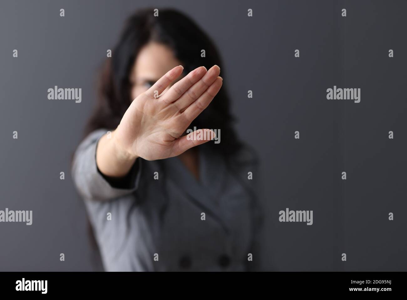 Woman shows negative gesture with her hand Stock Photo - Alamy