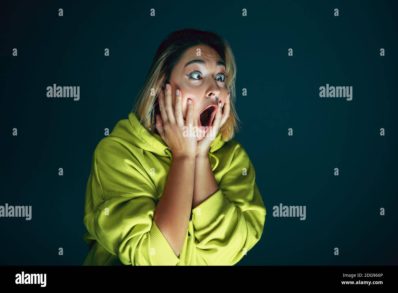 Screaming. Portrait of young crazy scared and shocked caucasian woman ...