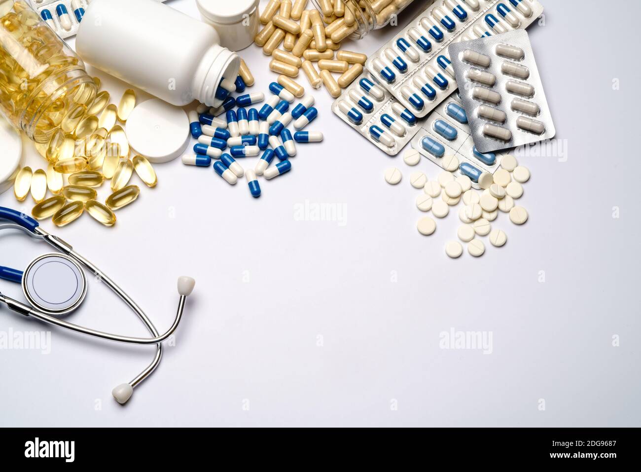 Medications capsules in plastic bottles on light grey background Stock ...