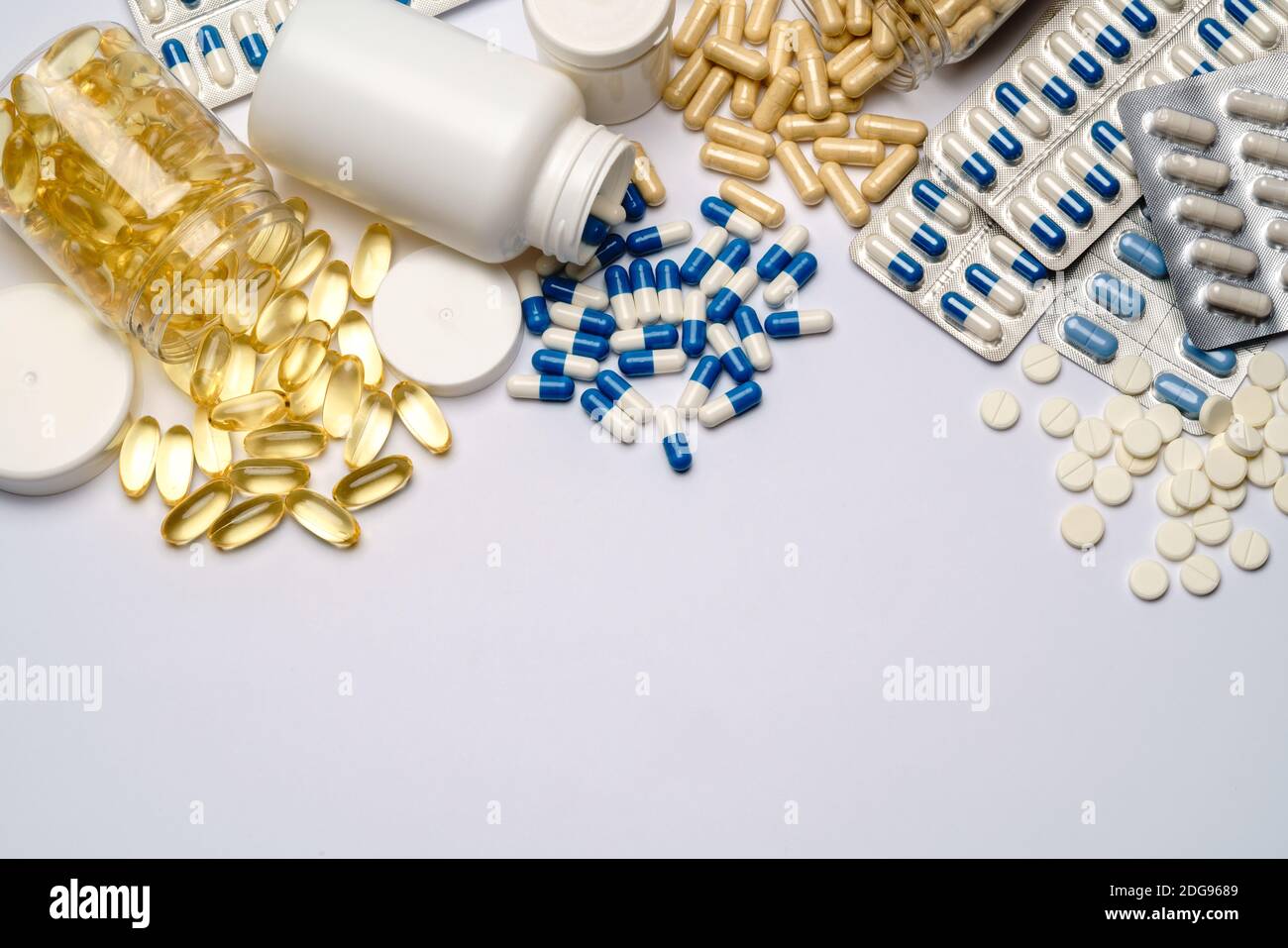 Medications capsules in plastic bottles on light grey background Stock ...