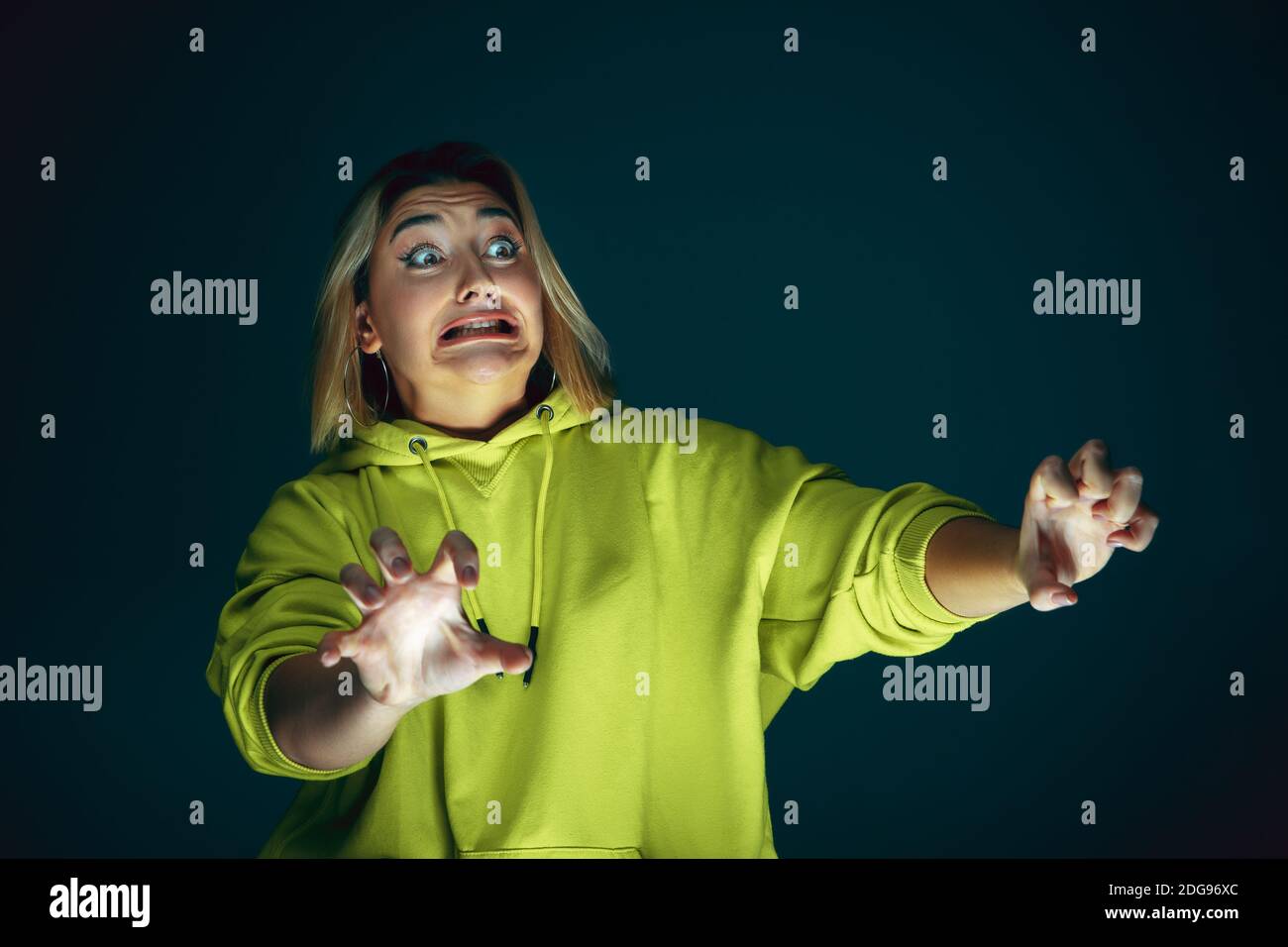 Trying to run. Portrait of young crazy scared and shocked caucasian ...