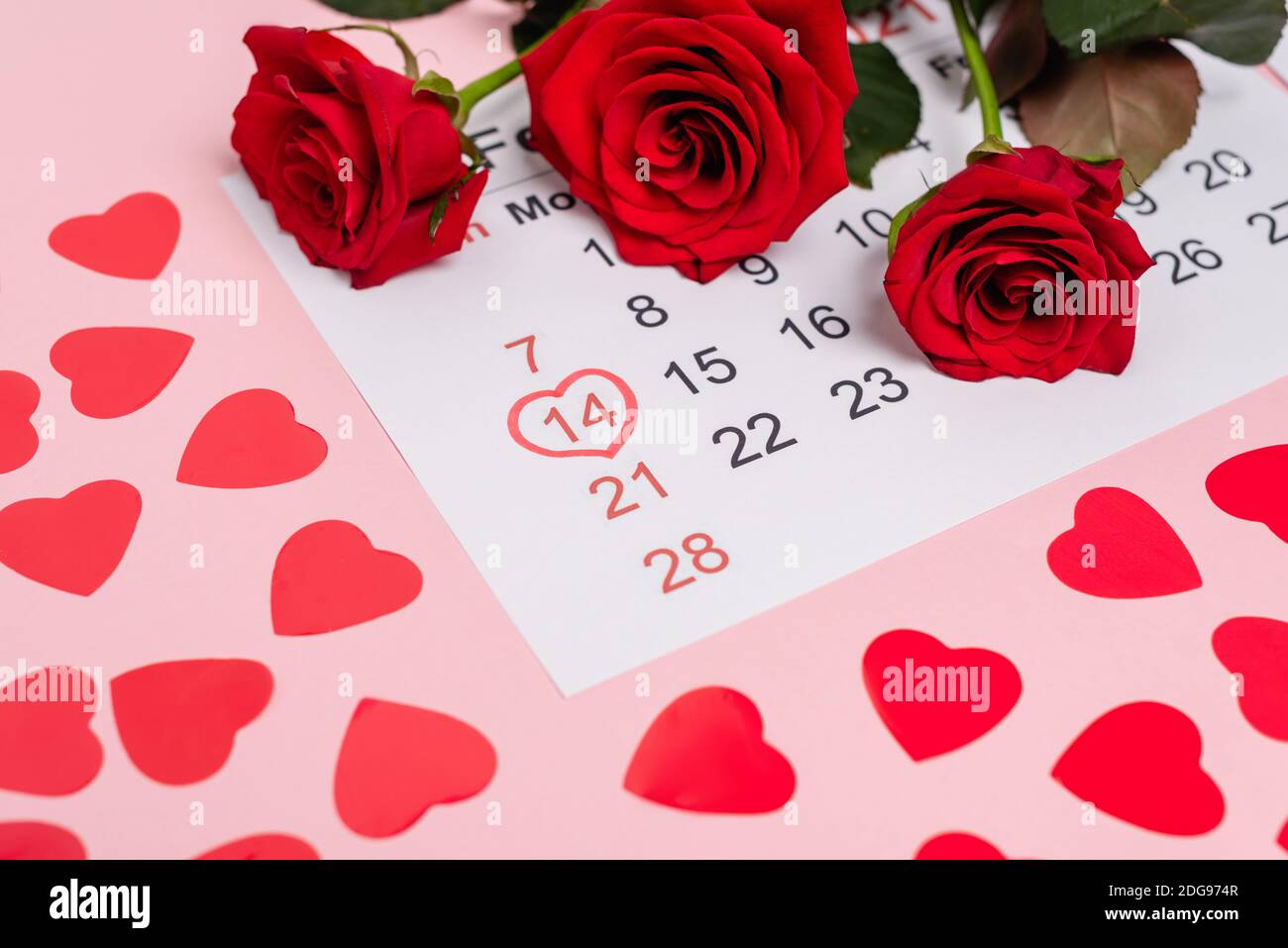 February calendar with hearts and roses on pink background Stock Photo ...