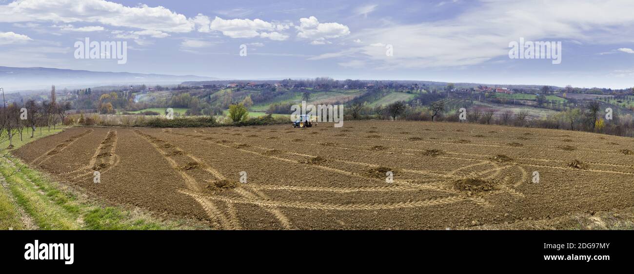 Drilling Holes with Tractor Stock Photo - Alamy
