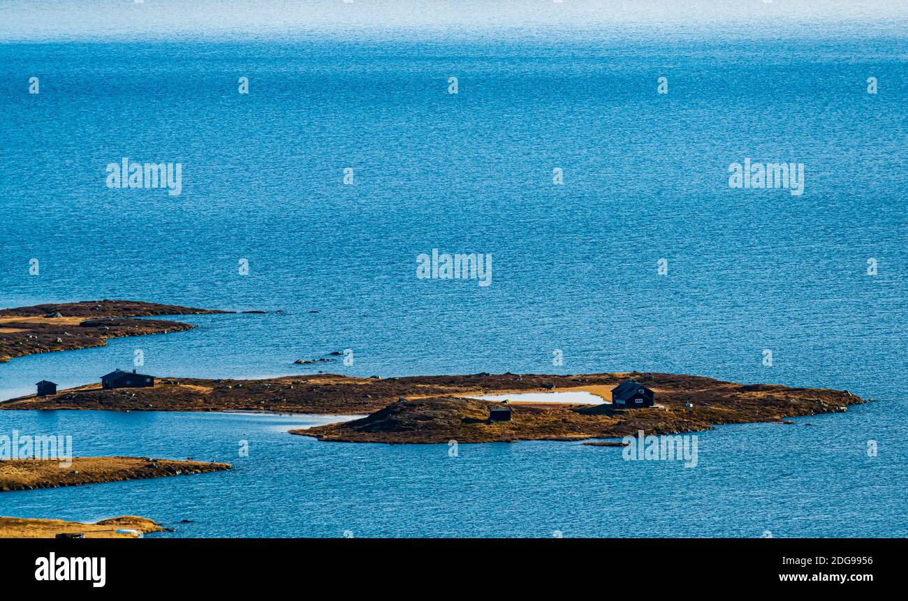 Small wooden cabin on an island in a lake in the high mountains Stock ...