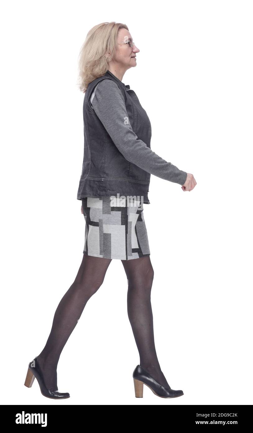 side view. confident young woman striding forward Stock Photo - Alamy