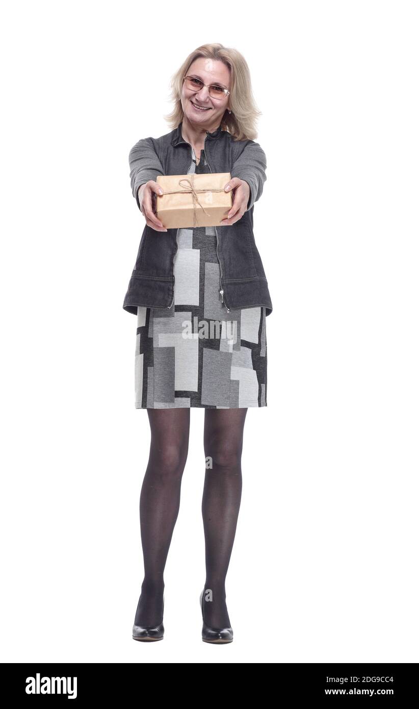 happy young woman holding out a gift box. isolated on a white ...