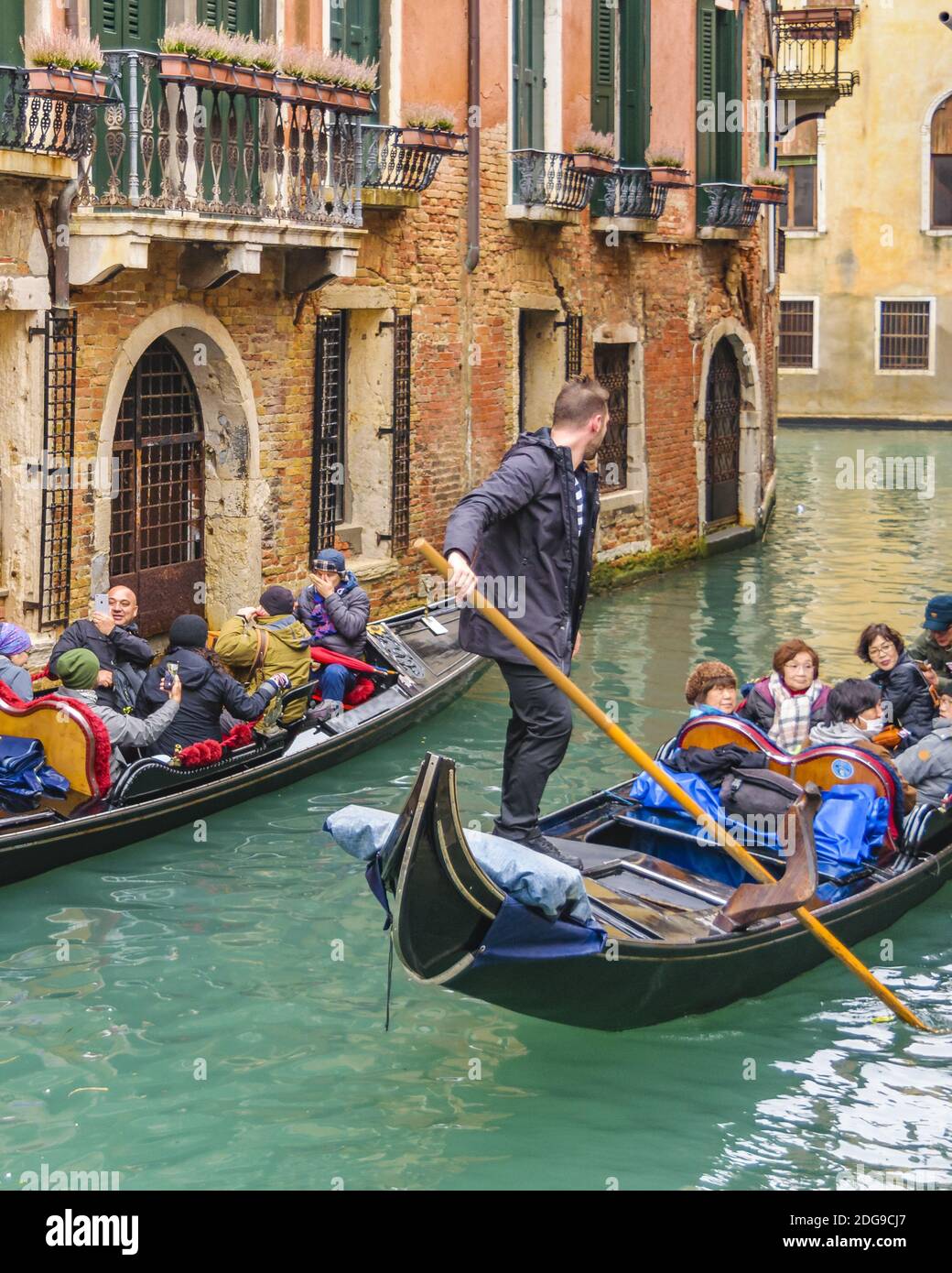 Gondoliers at Venice Canal Stock Photo - Alamy