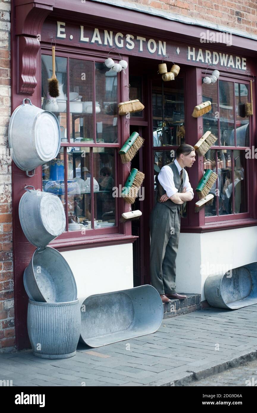 Shopkeeper Stands Outside An Old Hardware Store At The Black Country ...